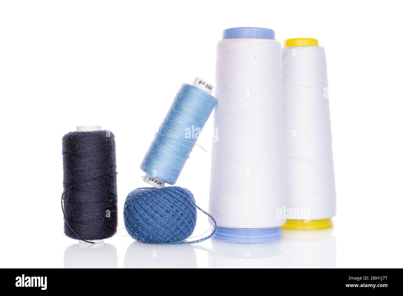 Group of five whole thread spool isolated on white Stock Photo - Alamy