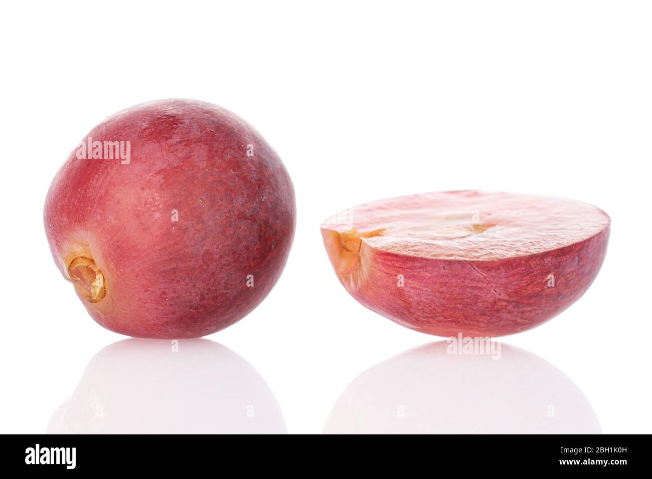 Group of one whole one half of fresh red globe grape isolated on white ...