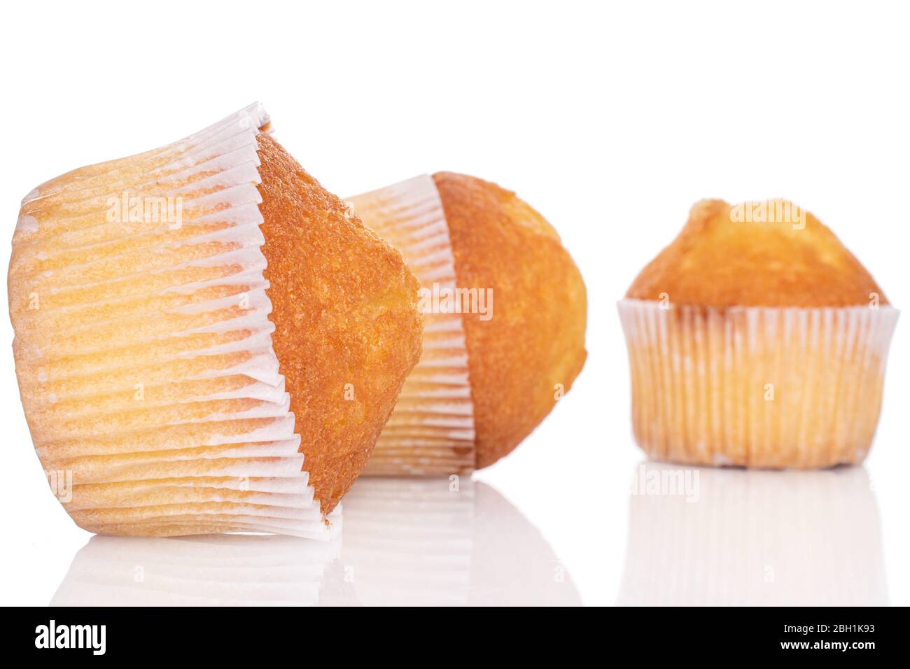 Group of three whole small baked muffin isolated on white Stock Photo ...