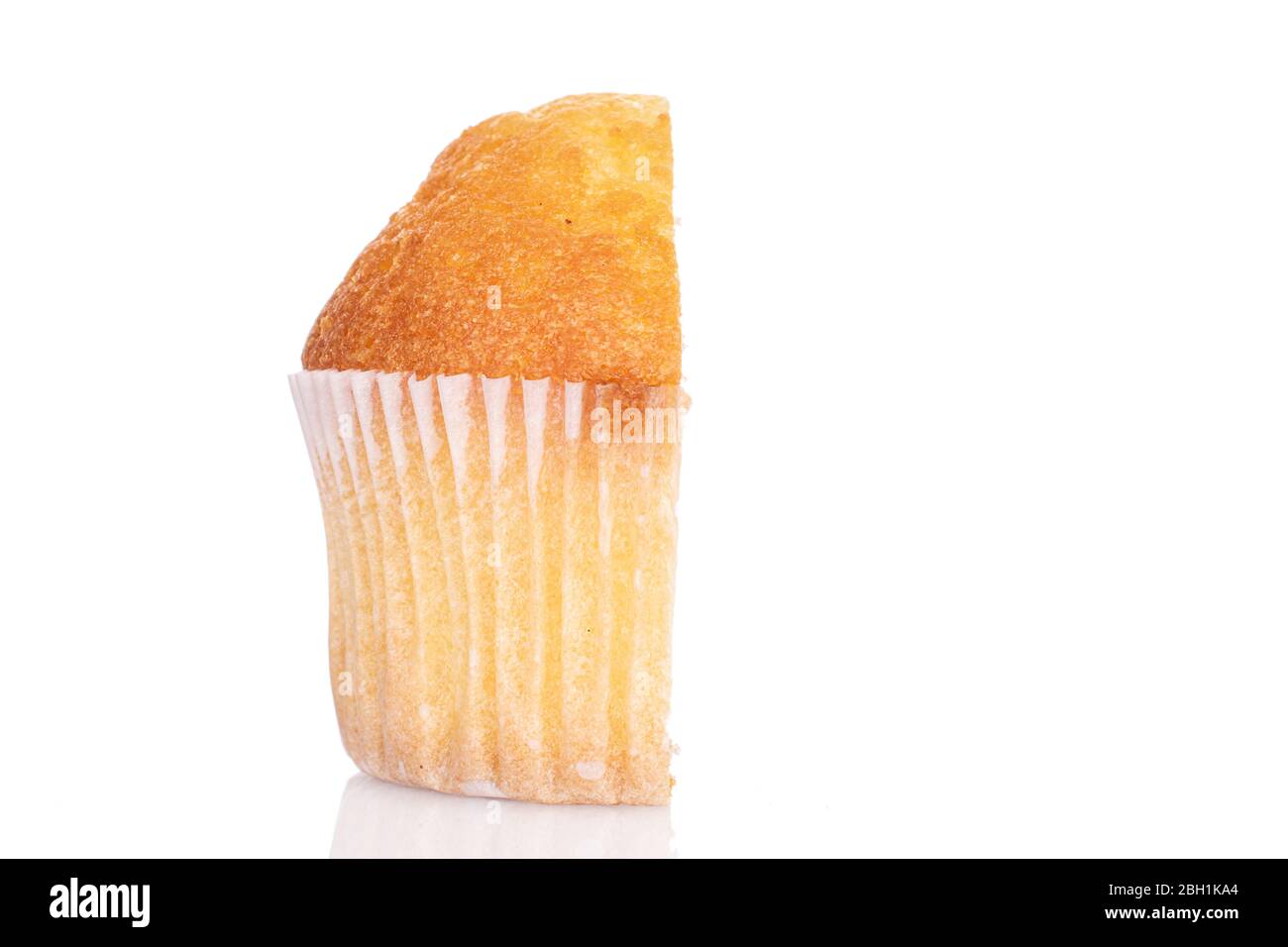 One half of small baked muffin isolated on white Stock Photo - Alamy