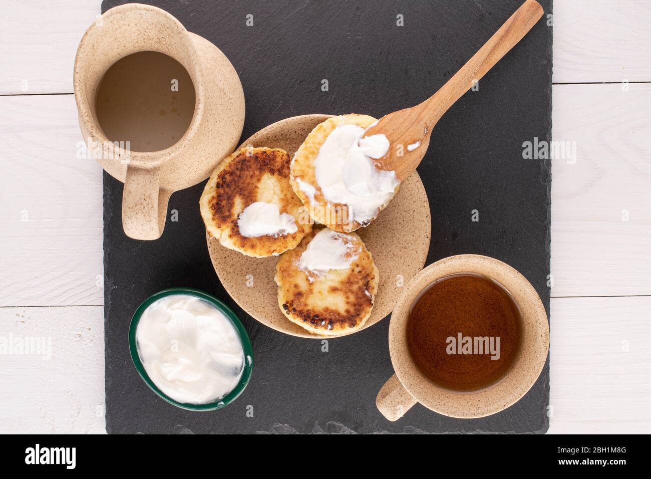 Group of three whole cheese pancake for breakfast on grey stone on ...