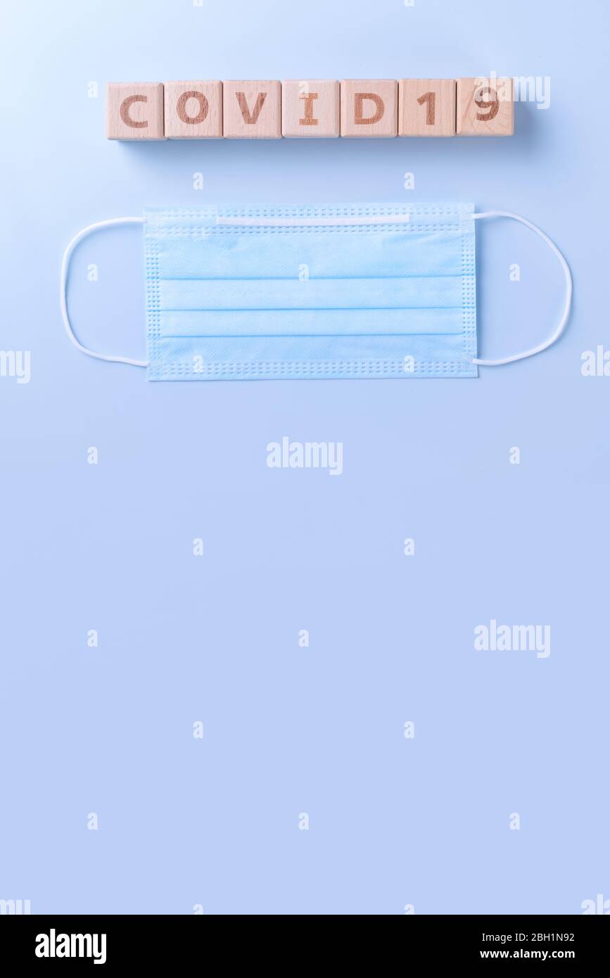 COVID-19 word wooden cube with mask, medical equipment, world disease ...