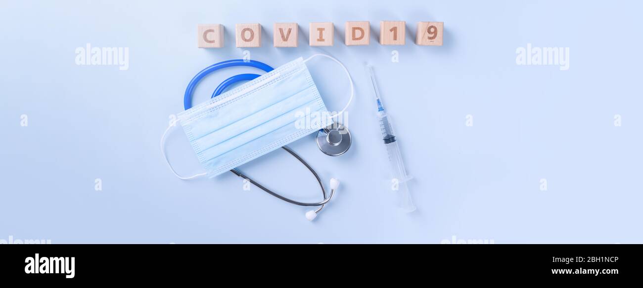 COVID-19 word wooden cube with mask, medical equipment, world disease ...