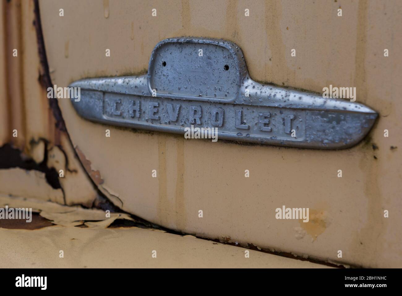 Chevrolet truck close up detail of the rusty logo plate Stock Photo - Alamy