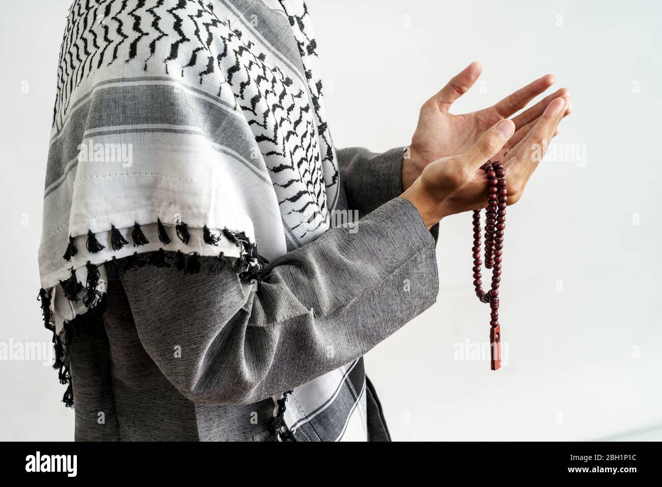 gesture of hand pray in islamic culture couting on prayer beads Stock ...