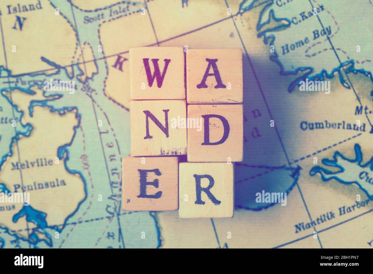 Wander word written in wooden blocks on a vintage travel map Stock ...