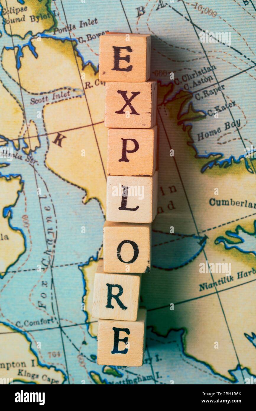 Explore word written in wooden blocks on a vintage travel map Stock ...