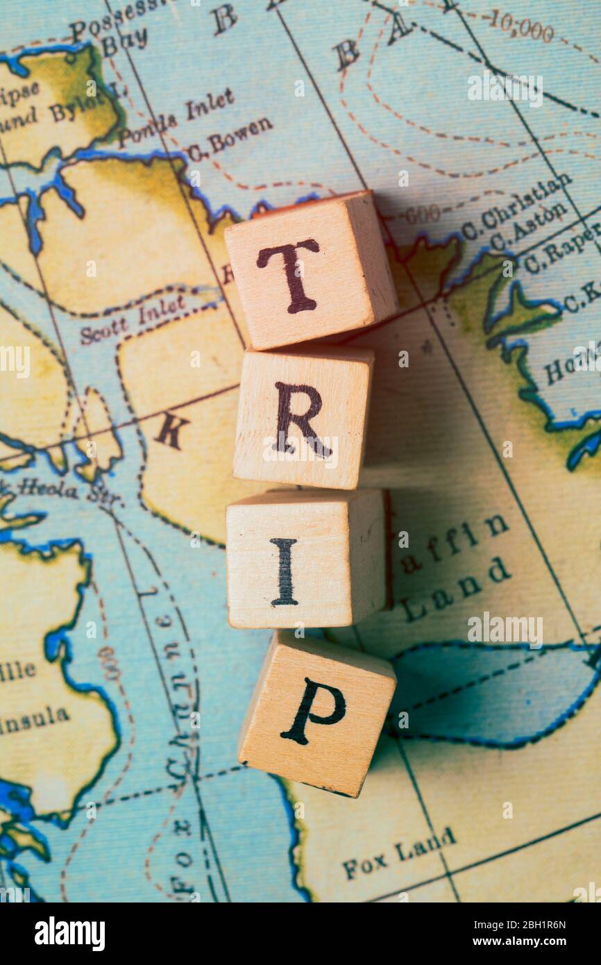 Trip word written in wooden blocks on a vintage travel map Stock Photo ...