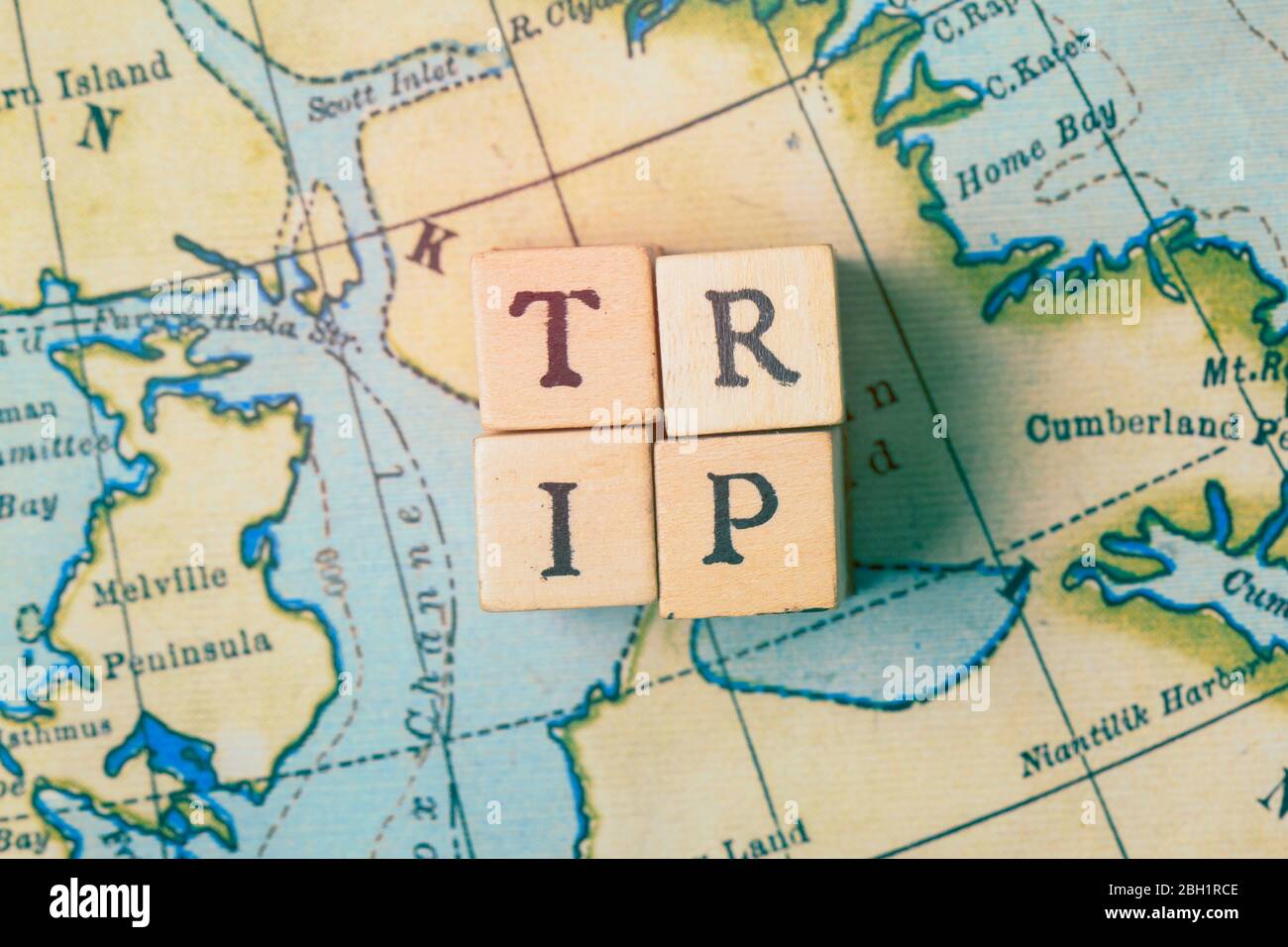 Trip word written in wooden blocks on a vintage travel map Stock Photo ...