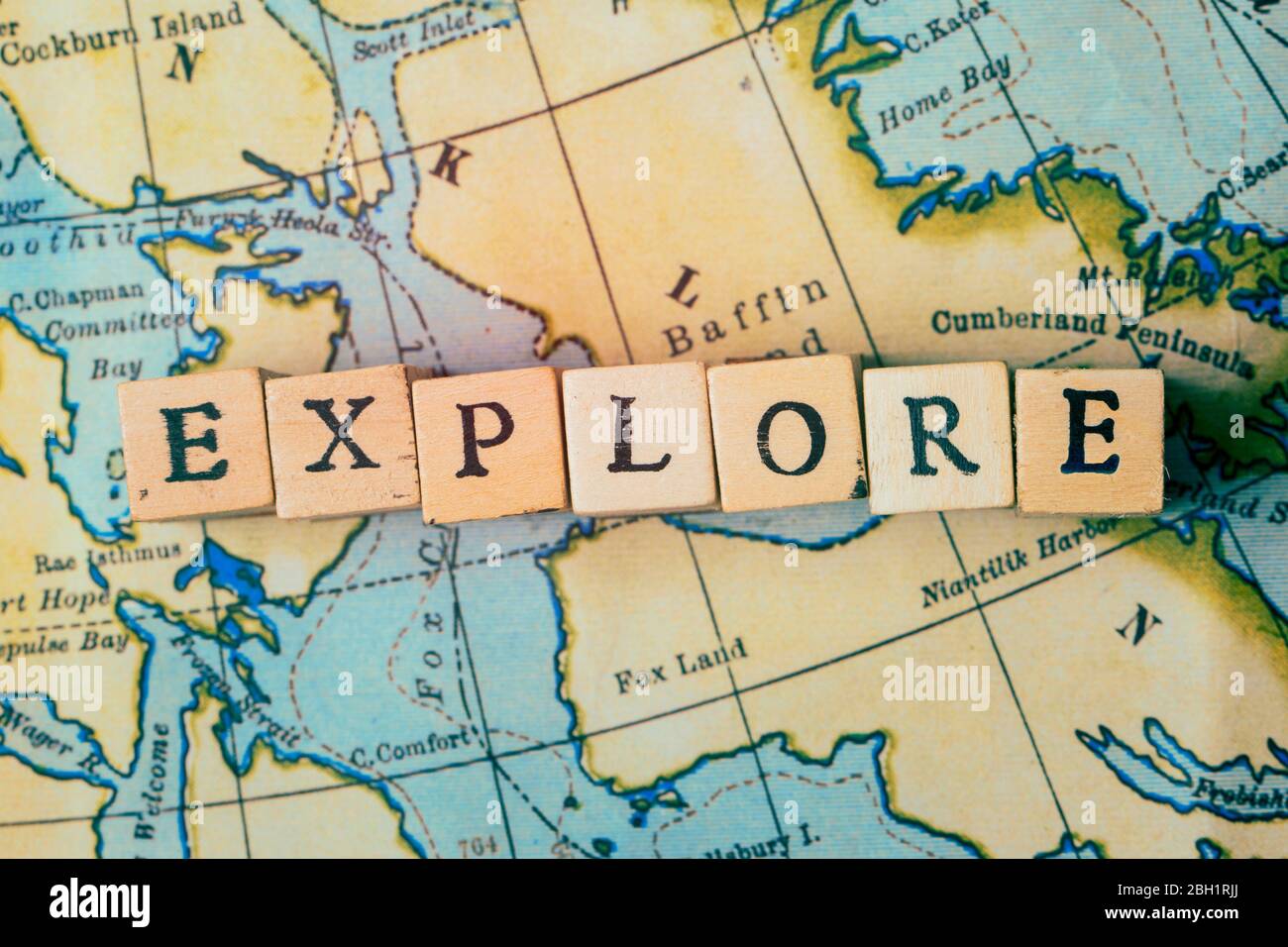 Explore word written in wooden blocks on a vintage travel map Stock ...