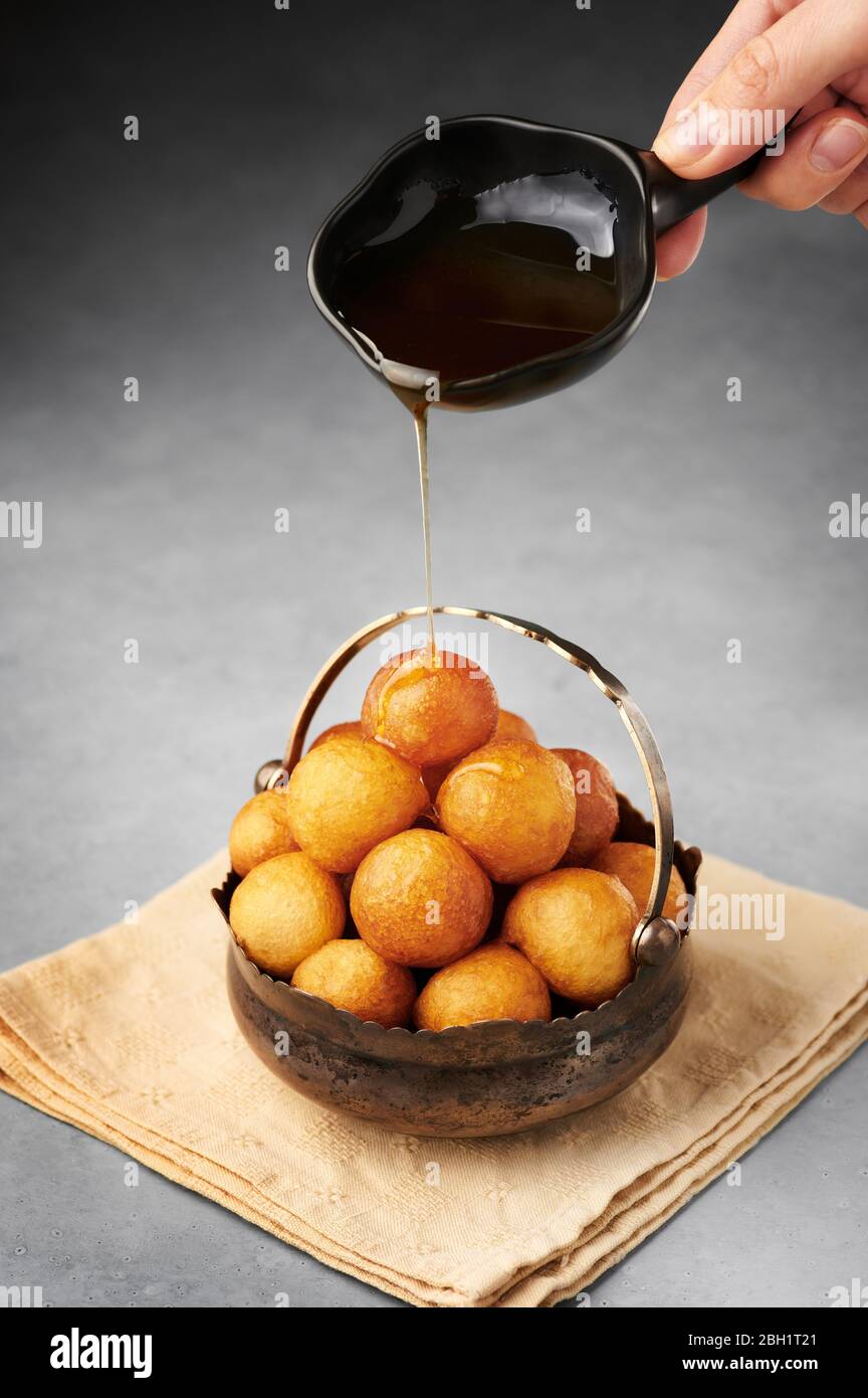 Loukoumades hi-res stock photography and images - Alamy