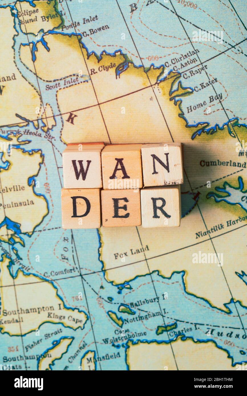 Wander word written in wooden blocks on a vintage travel map Stock ...
