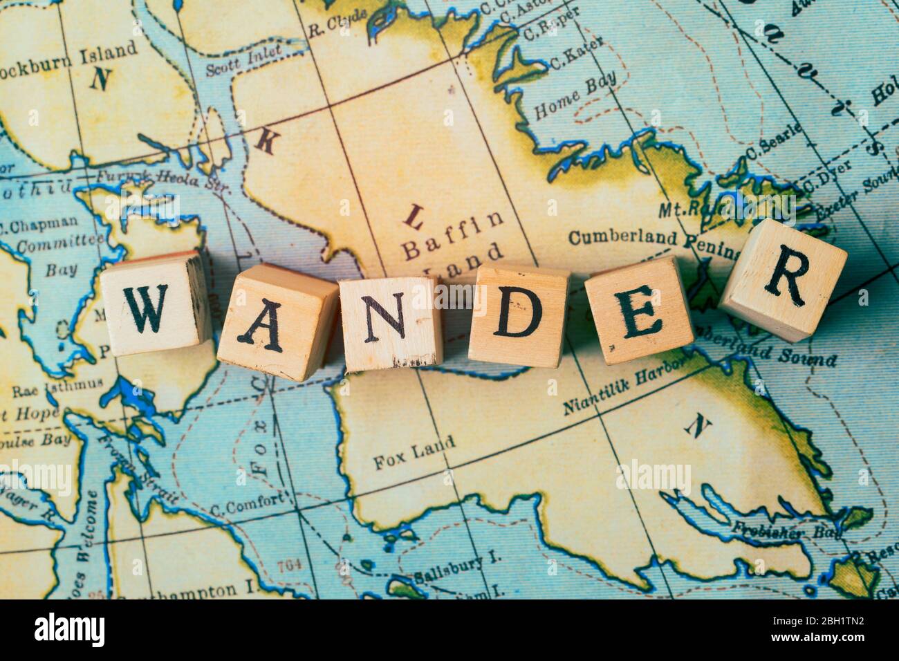 Wander word written in wooden blocks on a vintage travel map Stock ...