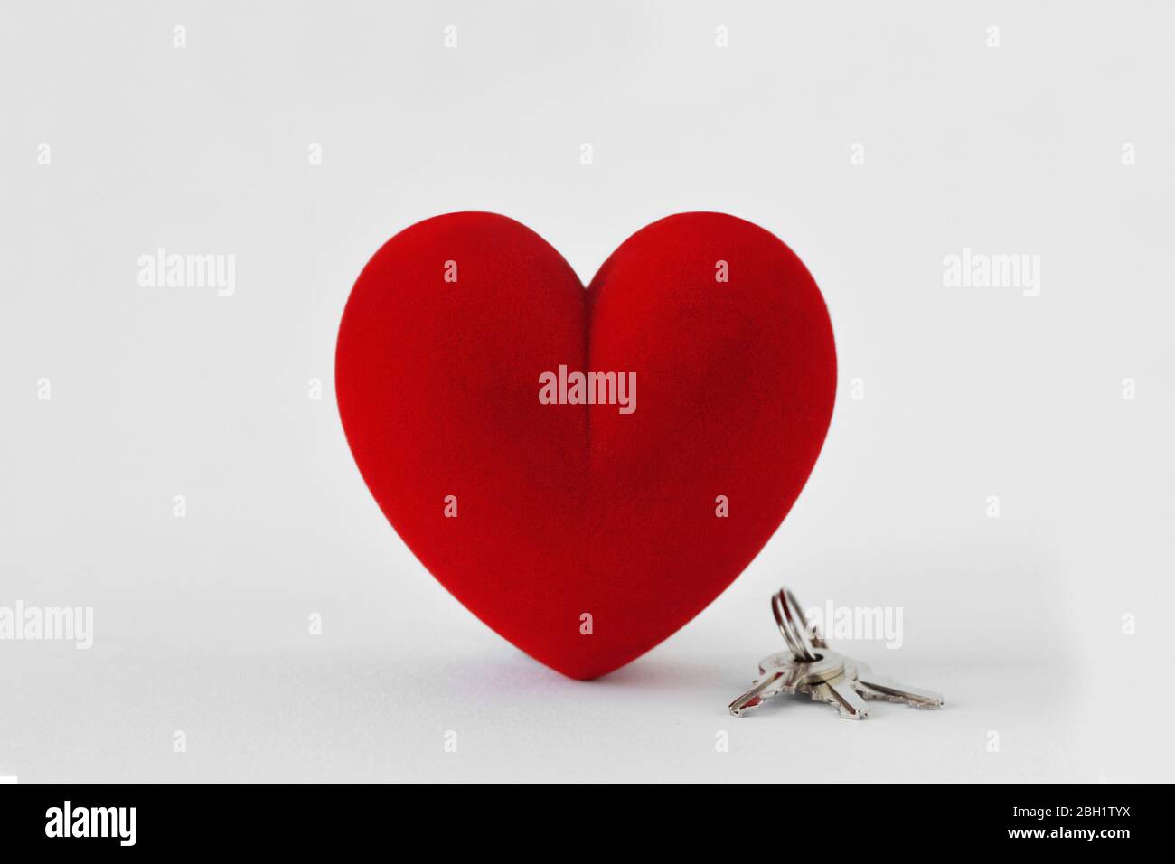 Heart with keys on white background - Concept of love Stock Photo - Alamy