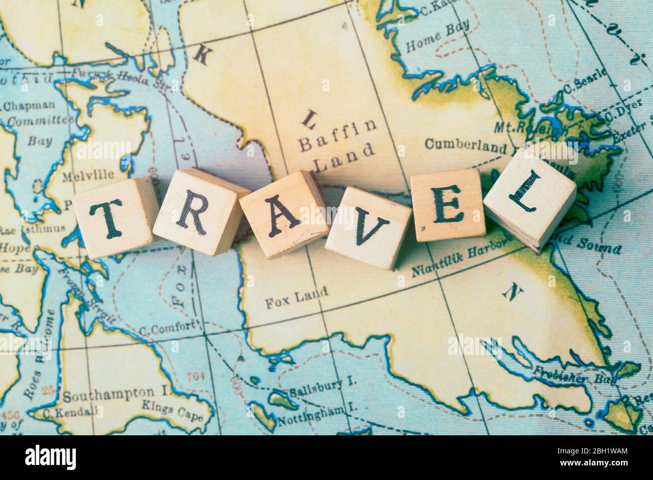 Travel word written in wooden blocks on a vintage travel map Stock ...