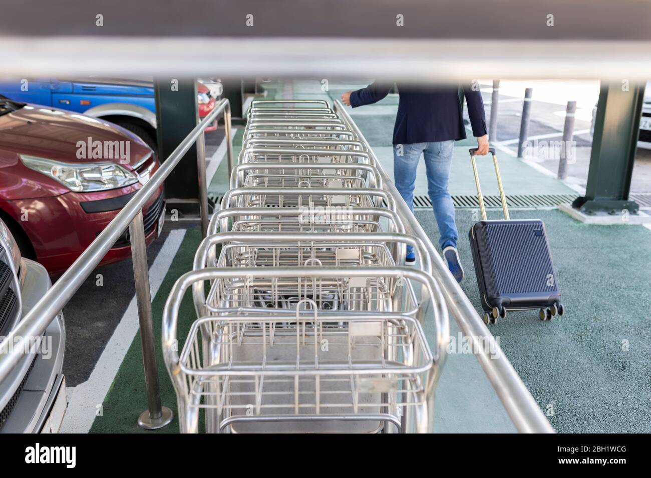 Man pulling trolley hi-res stock photography and images - Alamy
