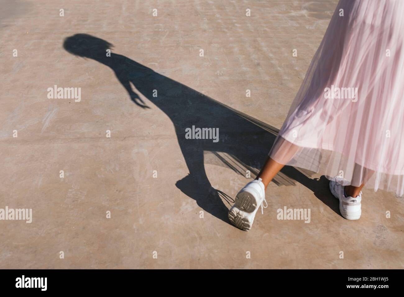 Shadow of young woman dancing Stock Photo - Alamy
