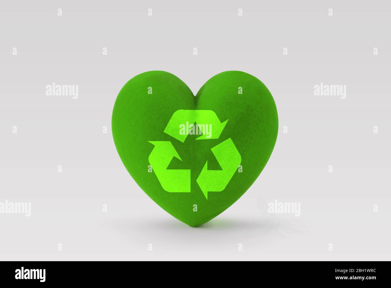 Green heart with recycling symbol on white background - Concept of ...