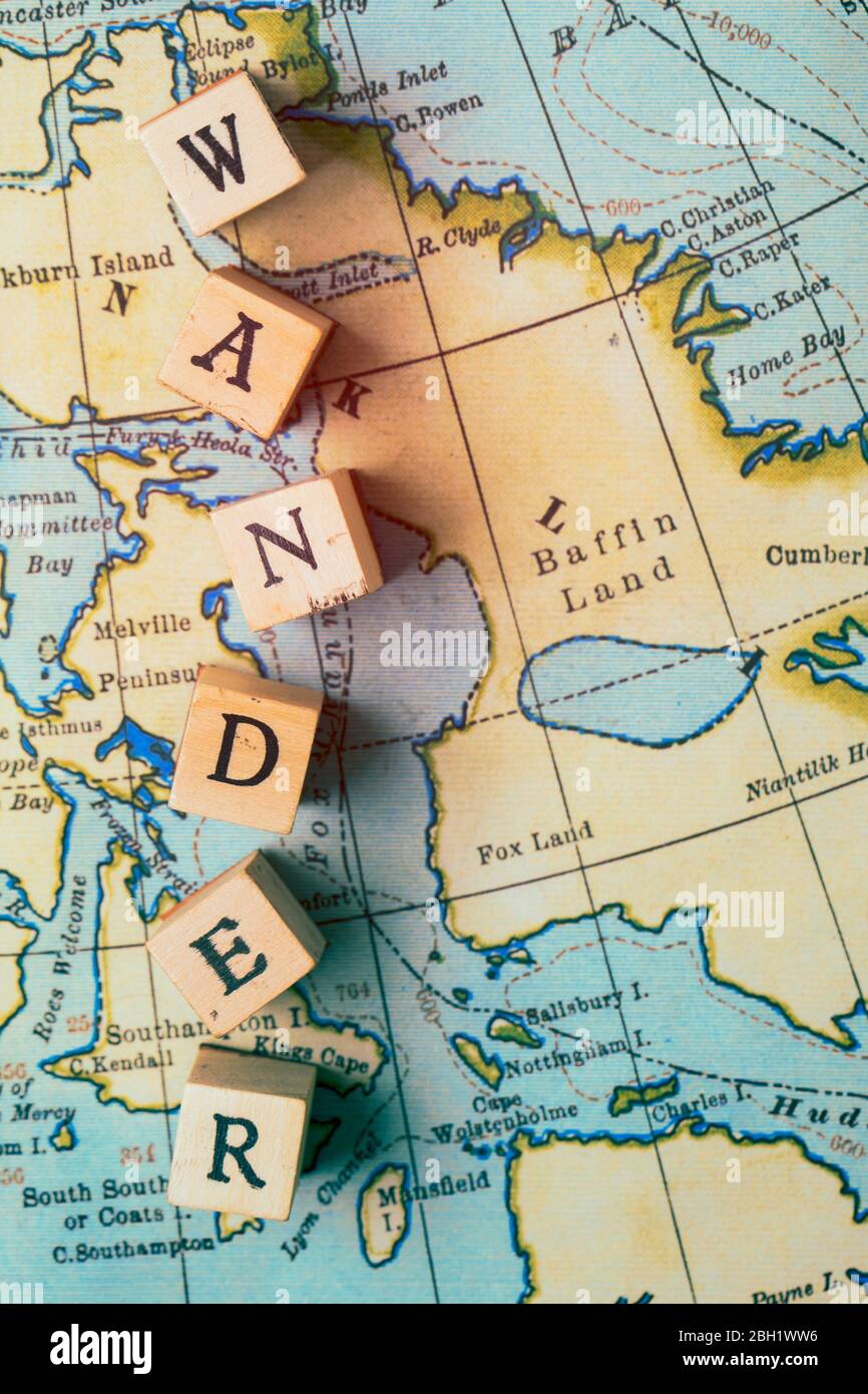Wander word written in wooden blocks on a vintage travel map Stock ...