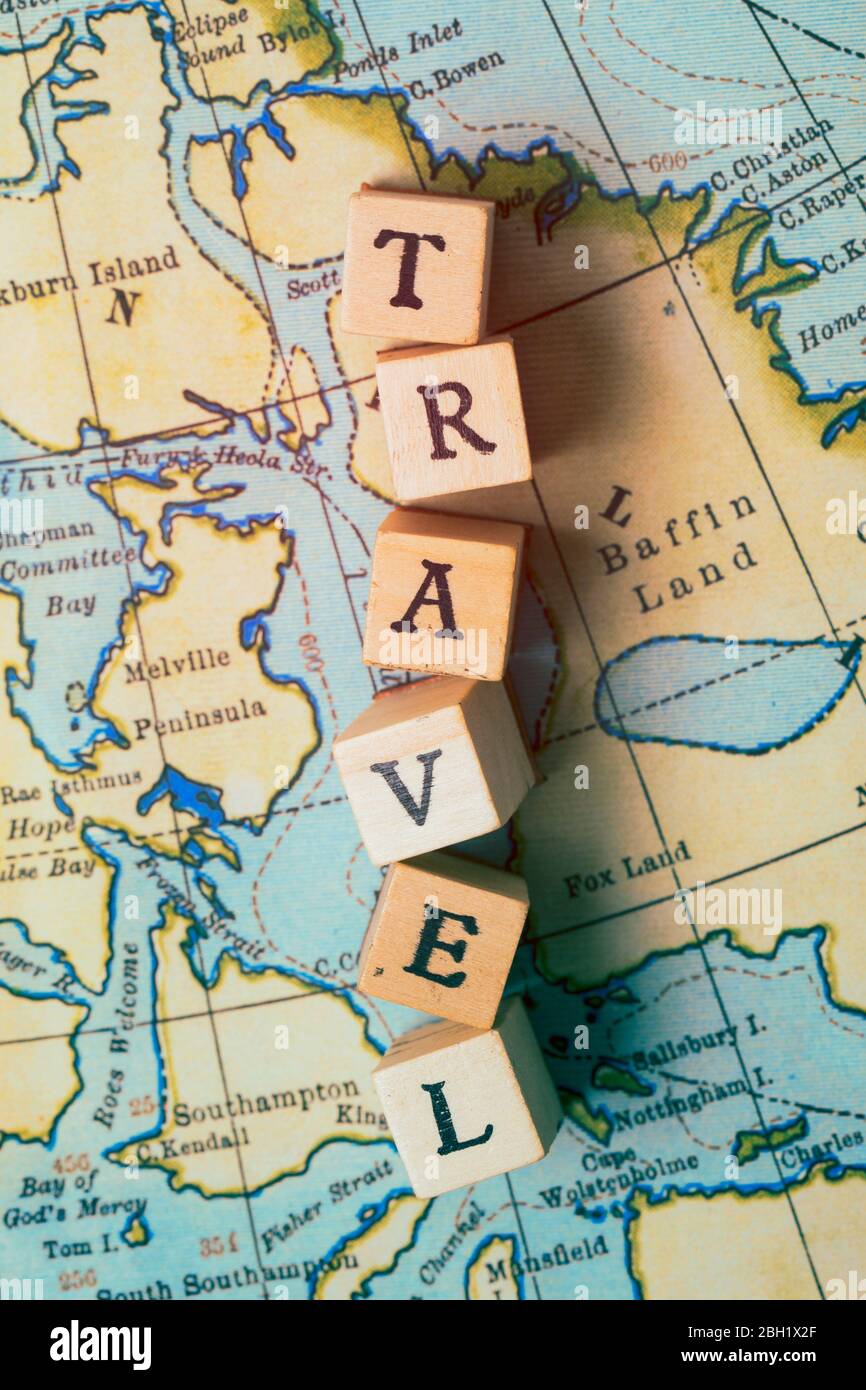 Travel word written in wooden blocks on a vintage travel map Stock ...