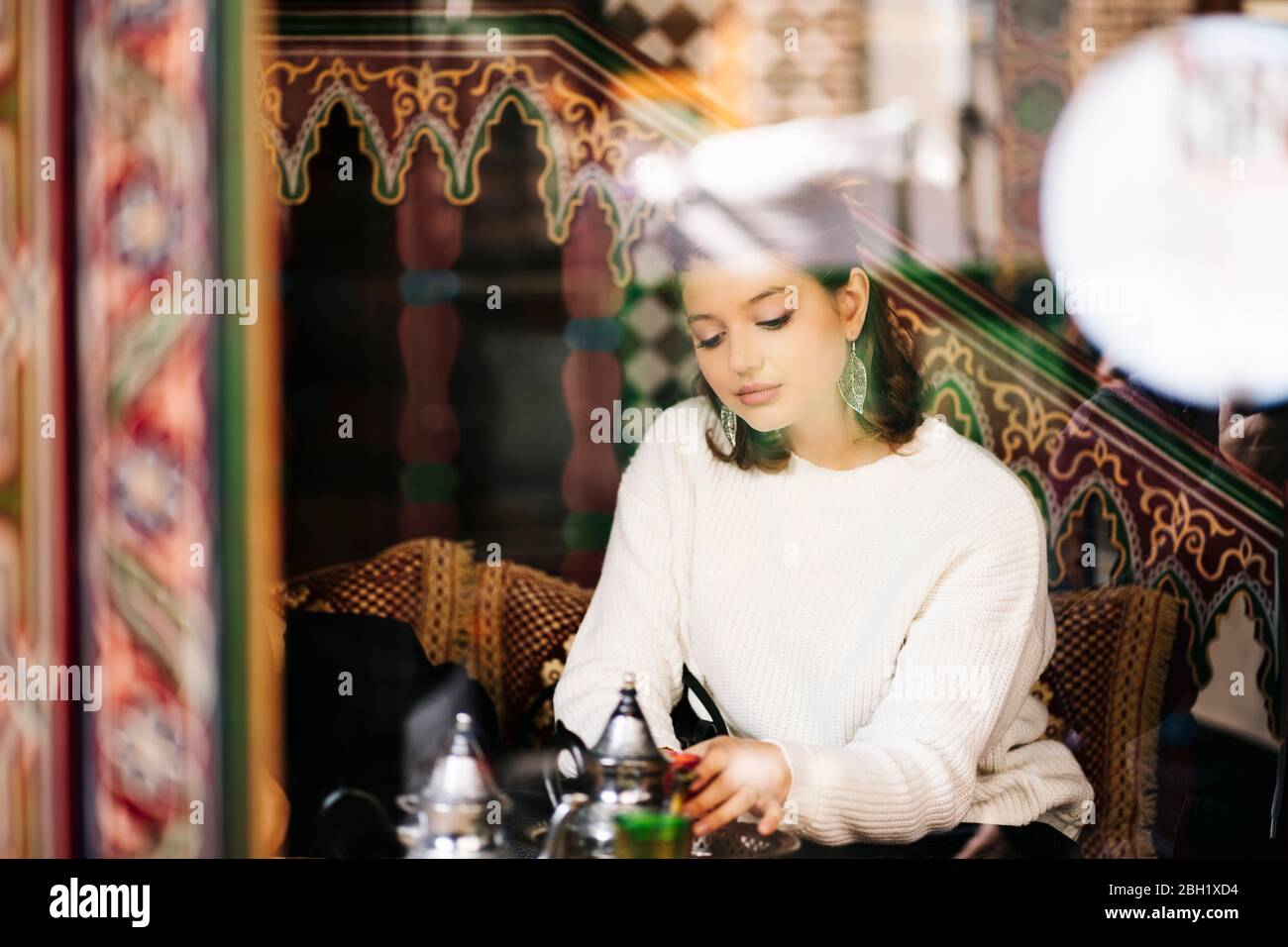 Portrait of pensive young woman drinking tea in a tea shop Stock Photo ... Portrait of pensive young woman drinking tea in a tea shop Stock Photo ...