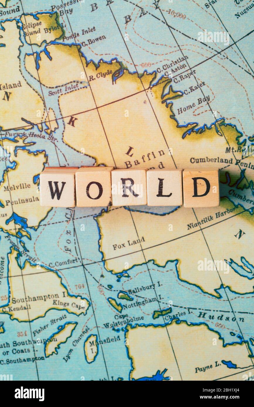 World word written in wooden blocks on a vintage travel map Stock Photo ...