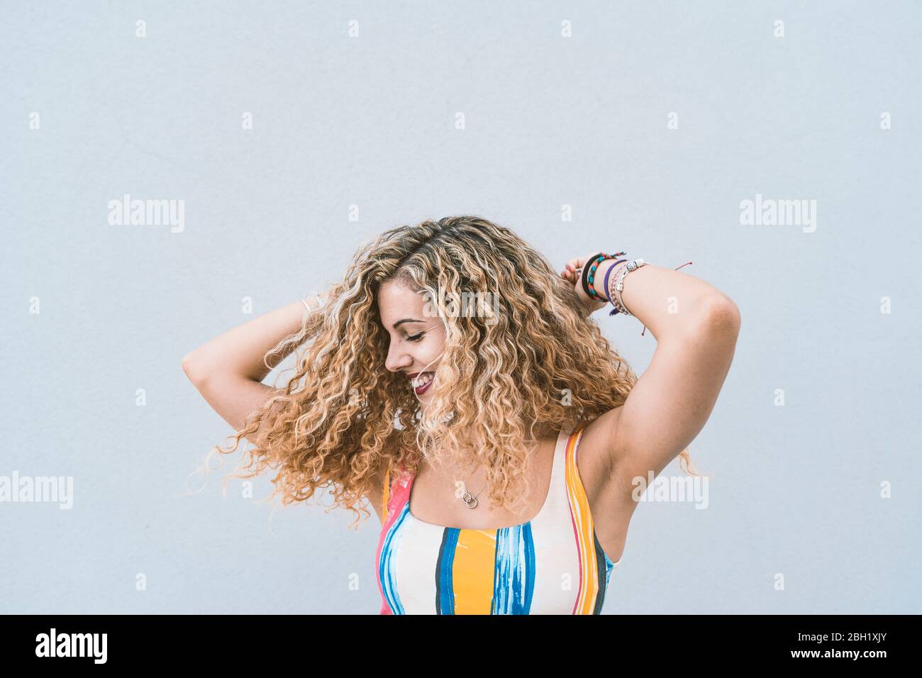 Woman dancing hands raised hi-res stock photography and images - Alamy