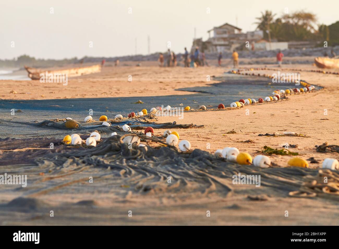 Empty fishing net lying on sandy coastal beach dusk hi-res stock ...
