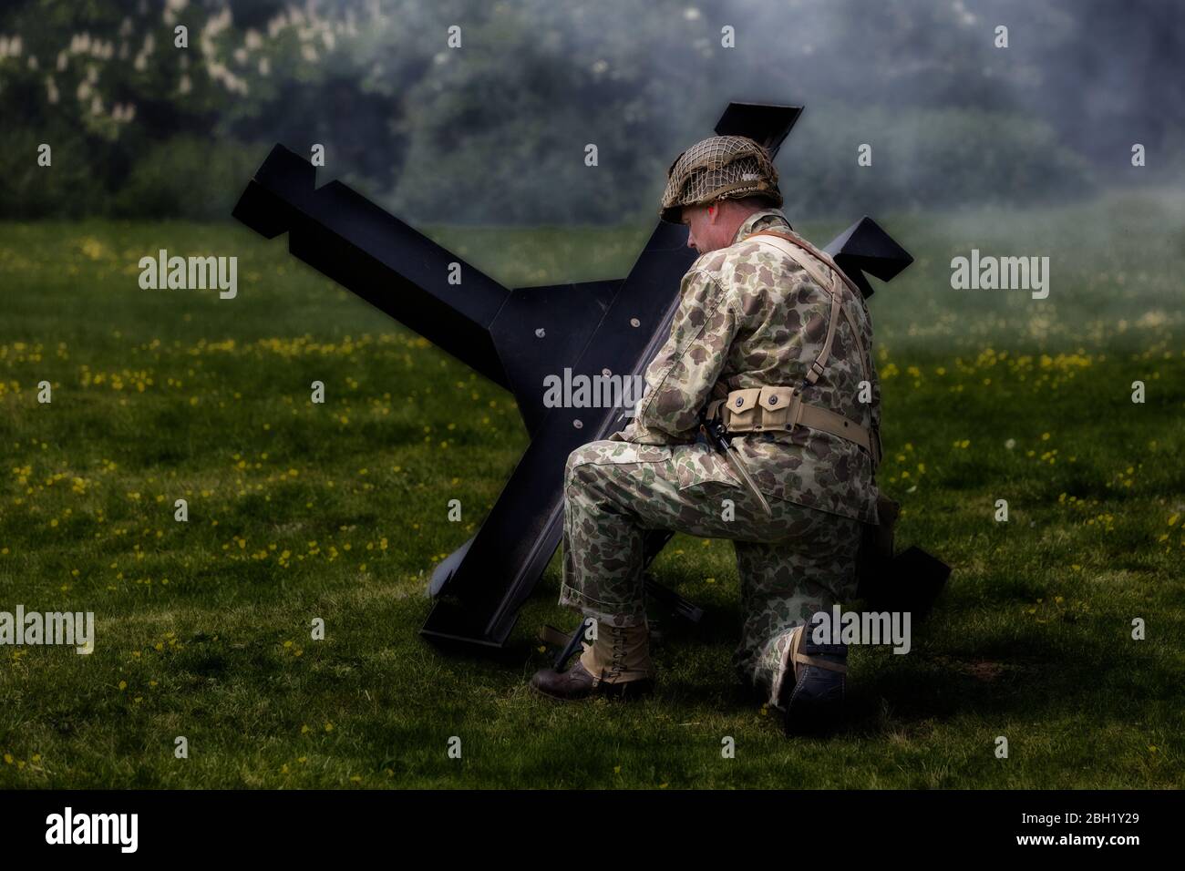 WW2 soldiers on the battlefield reenacting battle scenes with guns and ...