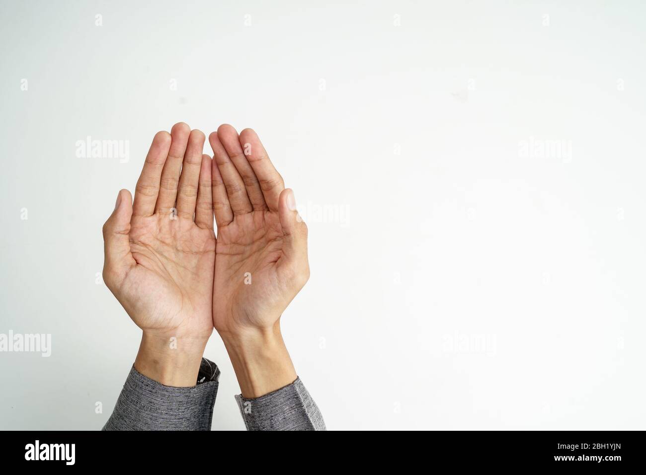 gesture of hand open arm while pray in islamic culture over white ...