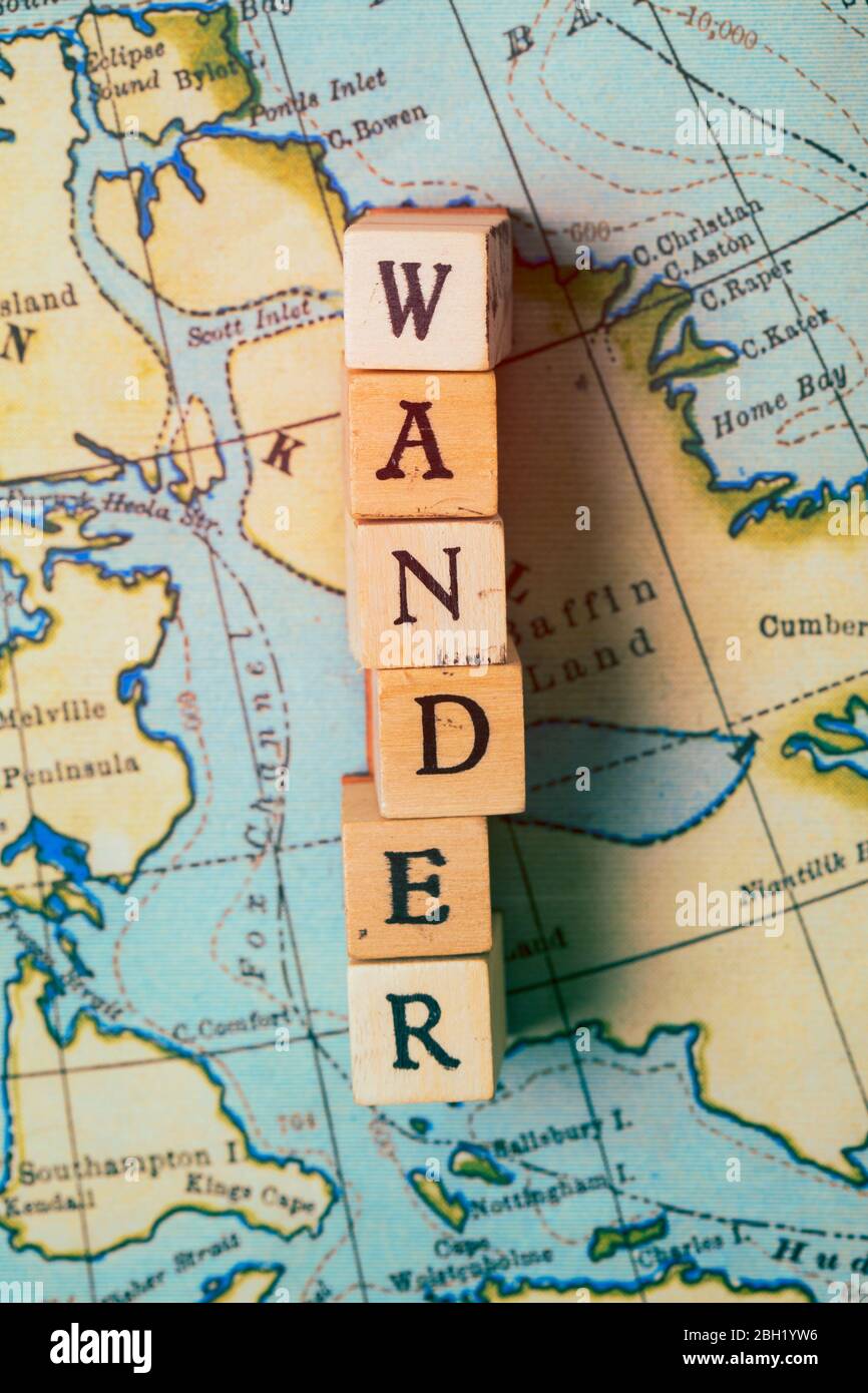Wander word written in wooden blocks on a vintage travel map Stock ...
