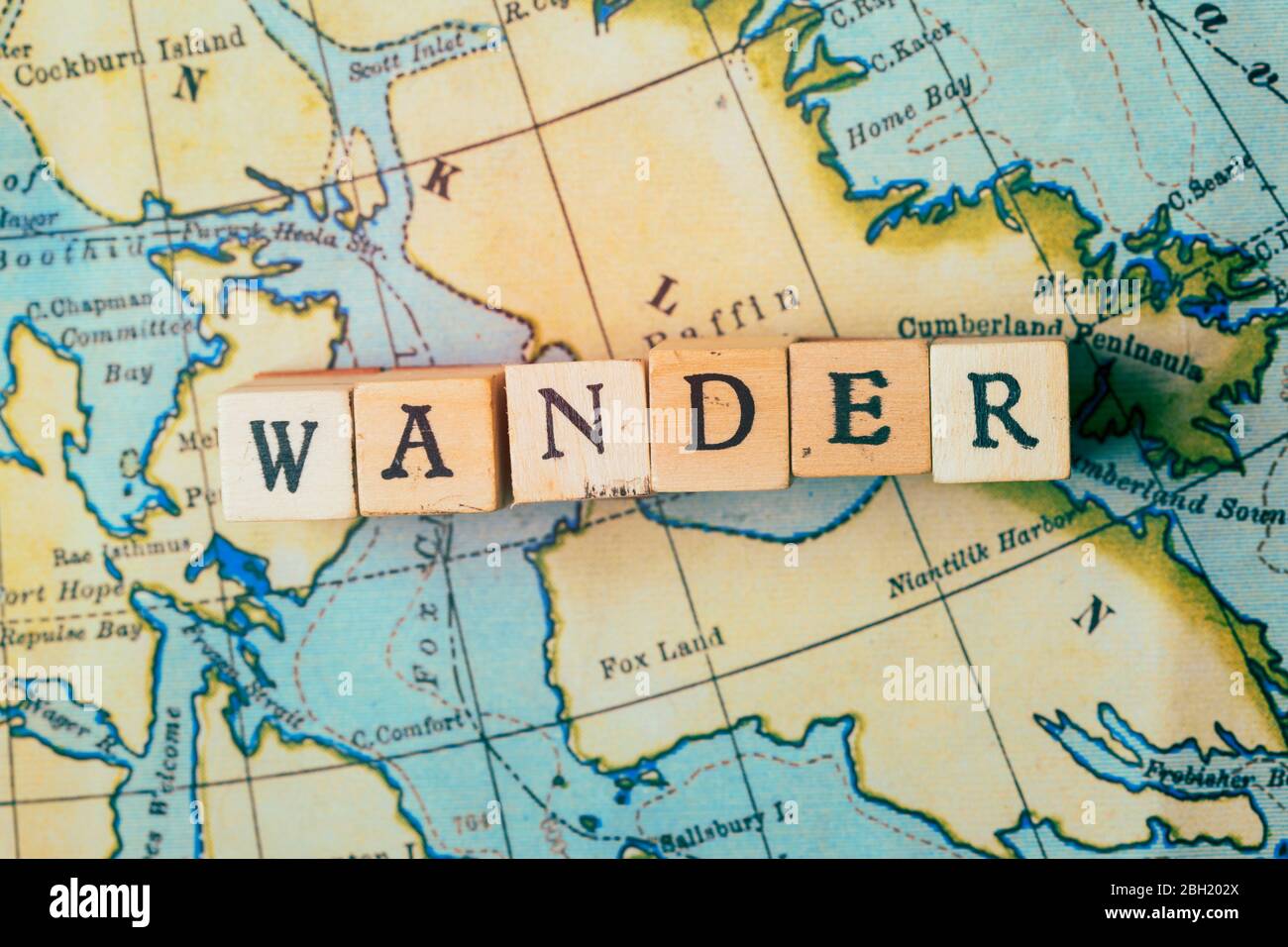 Wander word written in wooden blocks on a vintage travel map Stock ...