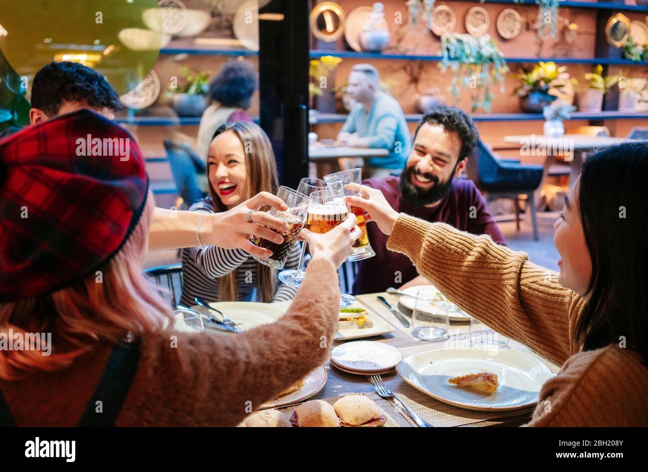 Mature group friends having dinner hi-res stock photography and images ...