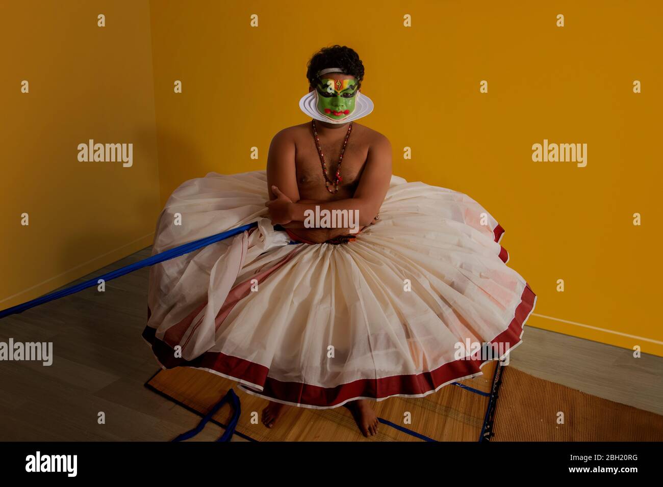 Kathakali dancer smiling while dressing up for his performance Stock ...