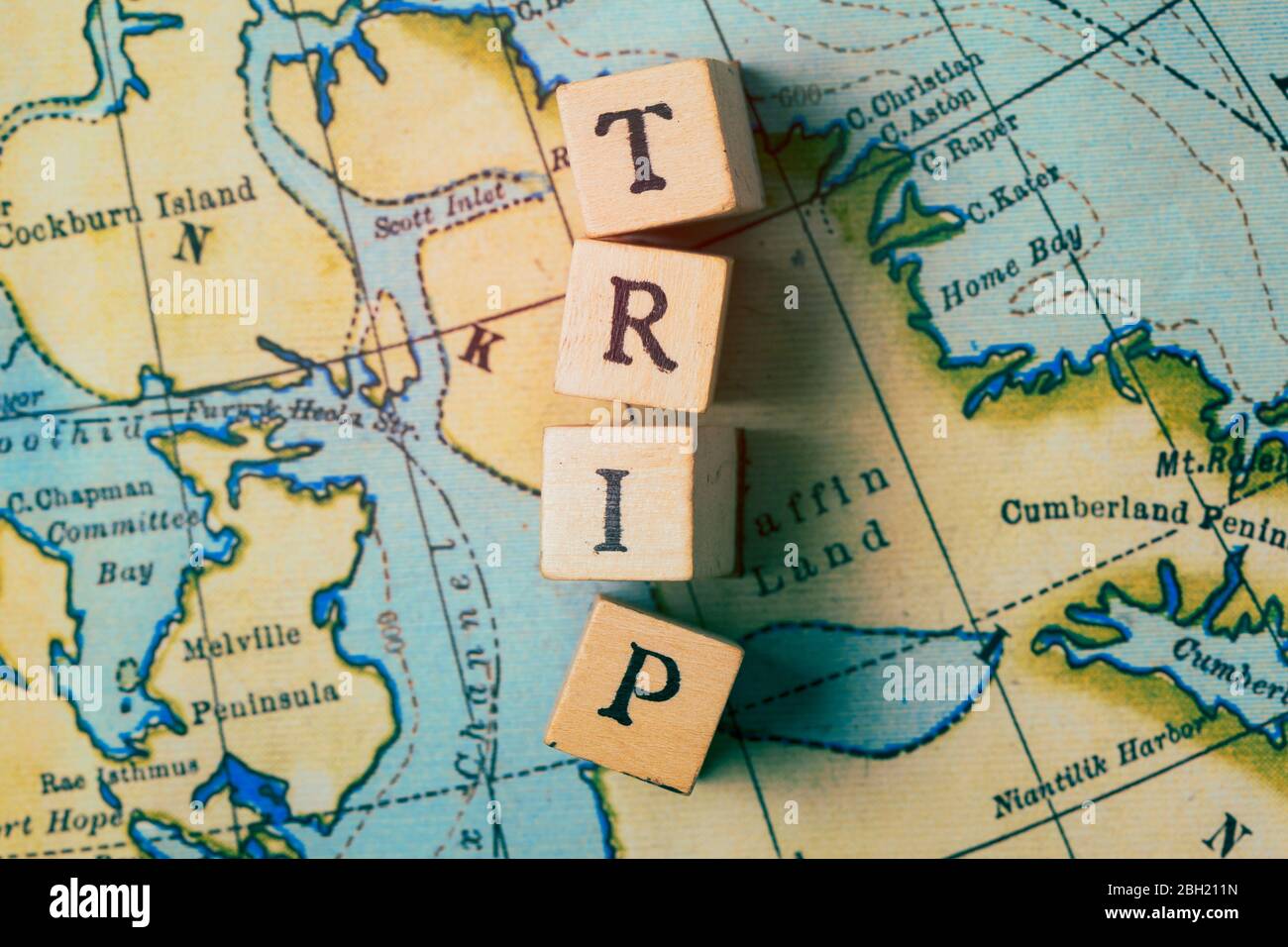 Trip word written in wooden blocks on a vintage travel map Stock Photo ...