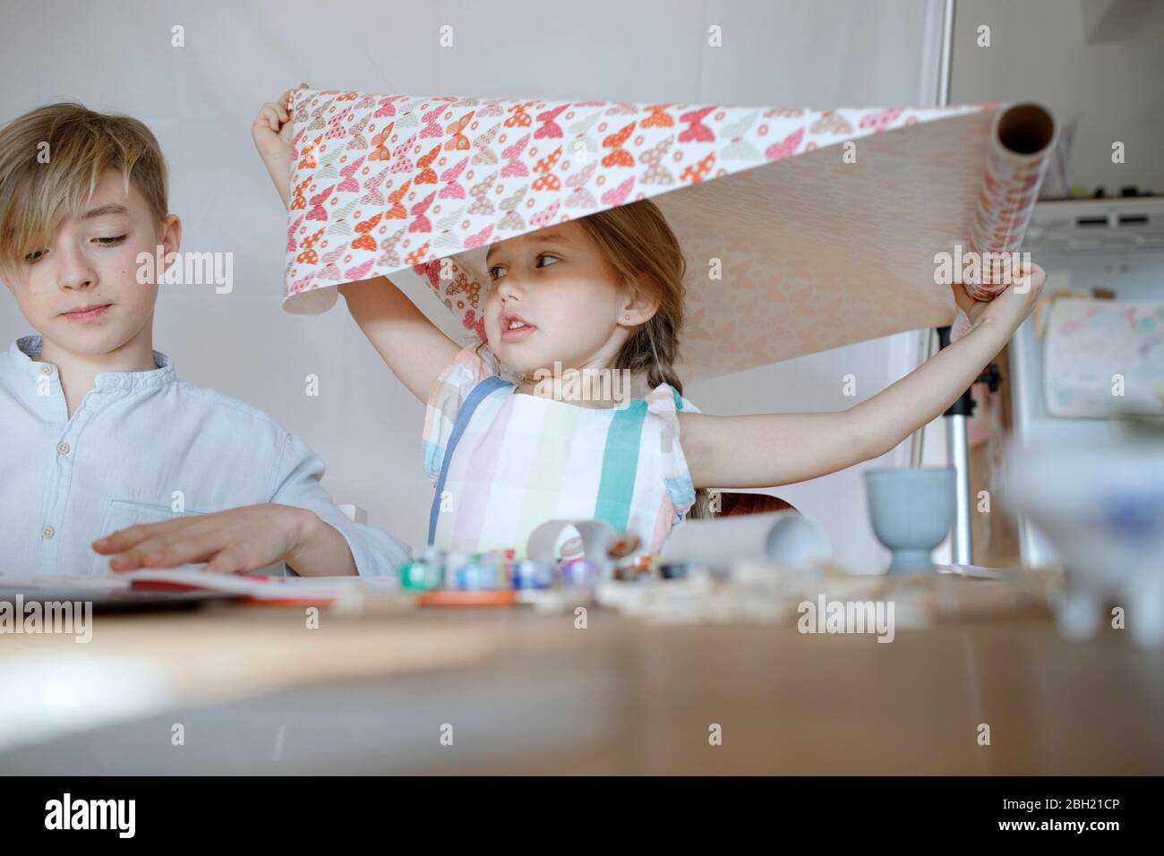 Boy and his little sister tinkering at home Stock Photo - Alamy