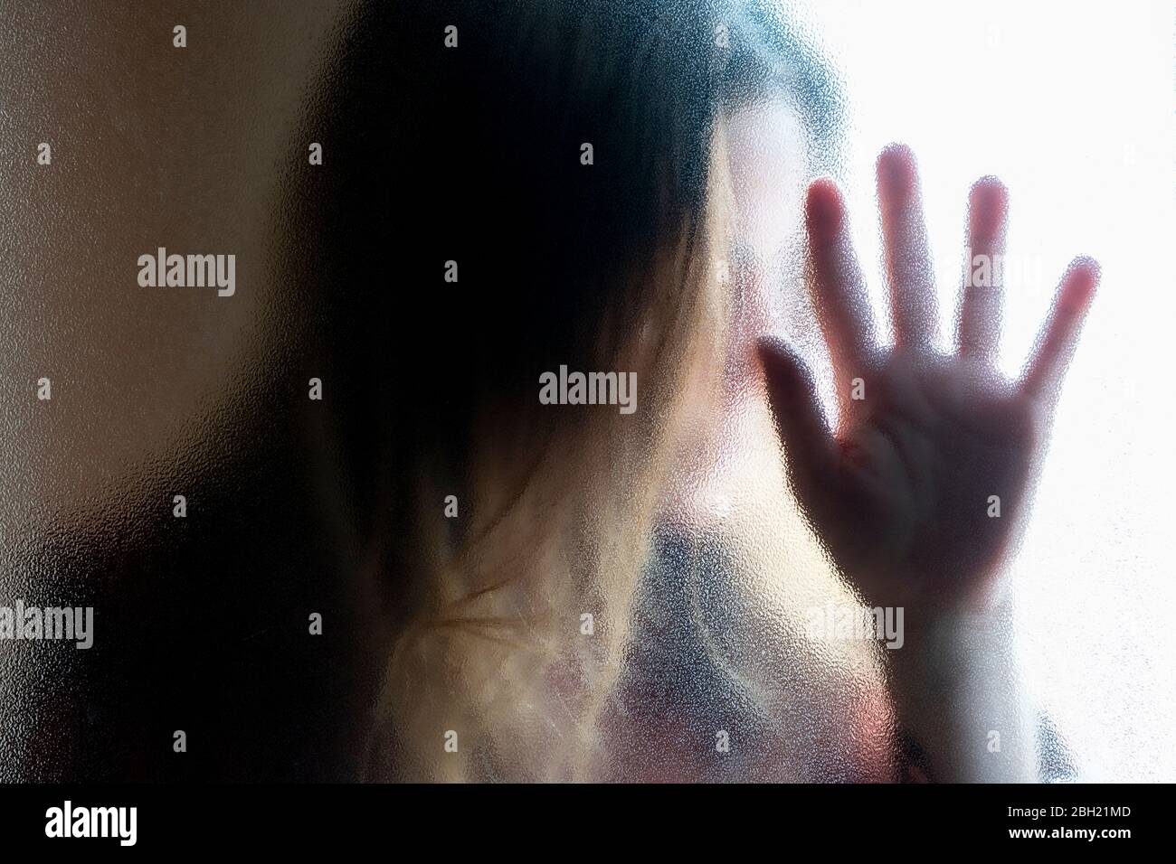 Woman behind glass hi-res stock photography and images - Alamy
