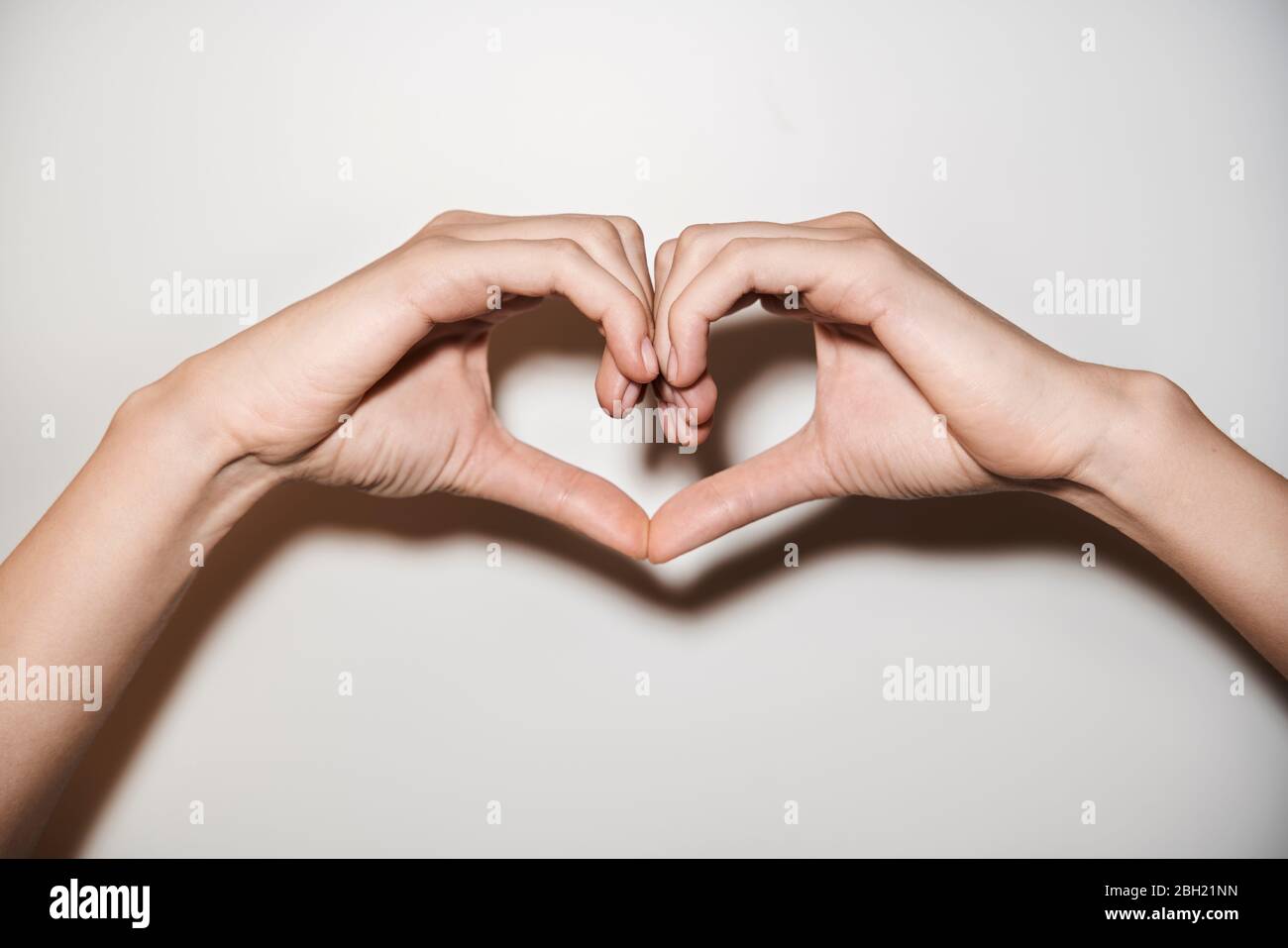 Hands building heart Stock Photo - Alamy