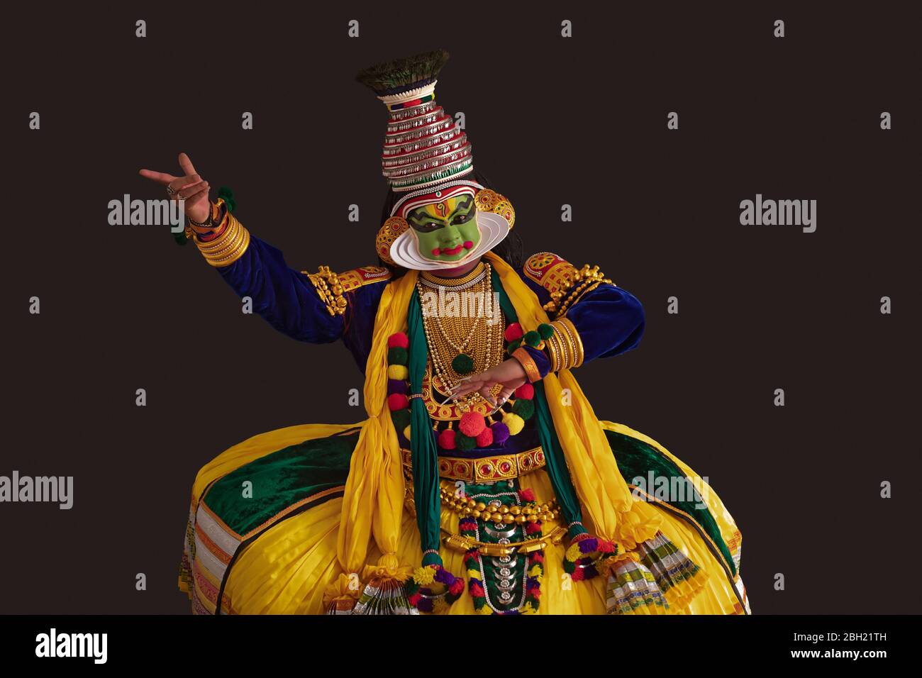 Kathakali dancer dancing in front of a dark background Stock Photo - Alamy