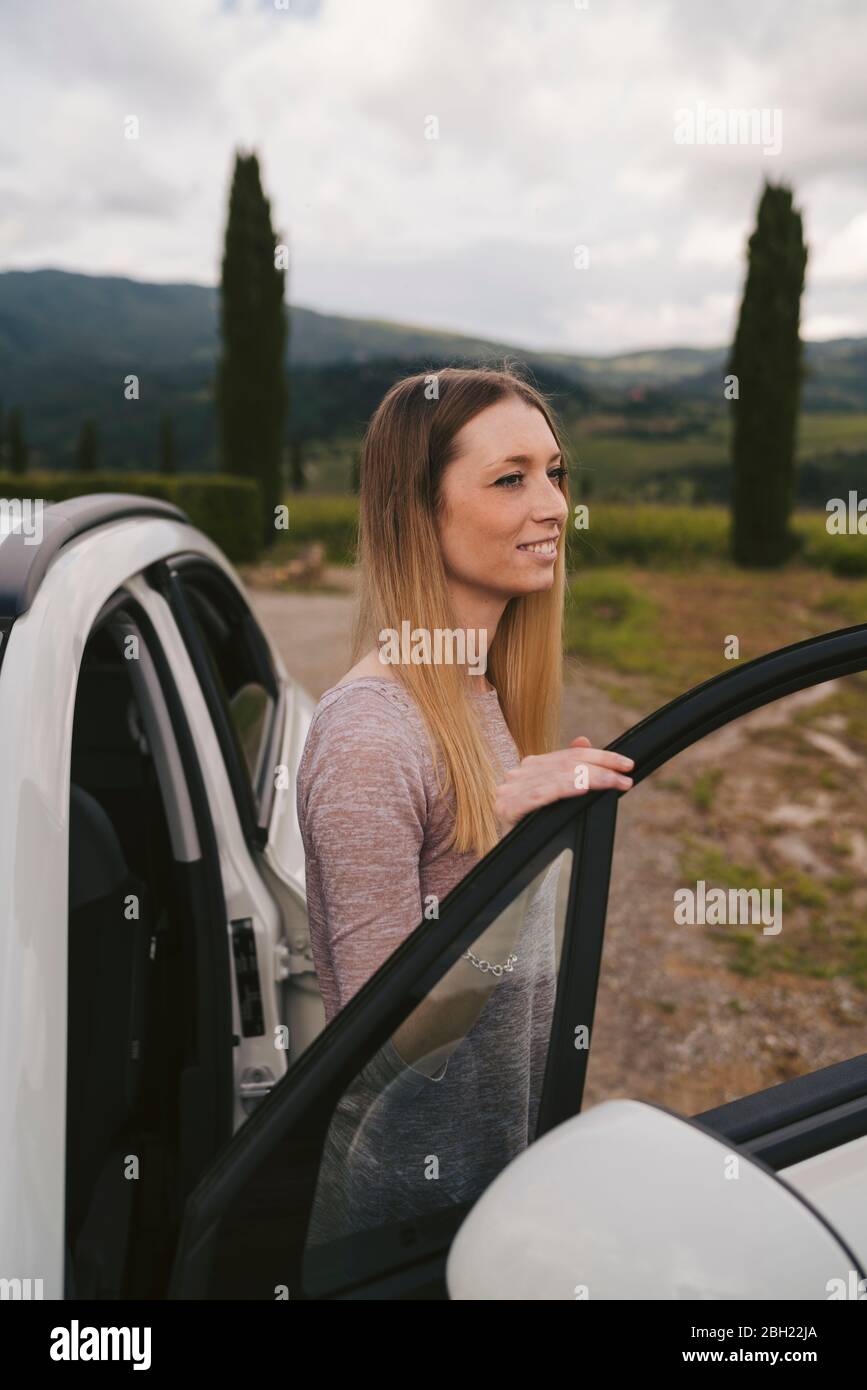 Female getting out of car hi-res stock photography and images - Alamy