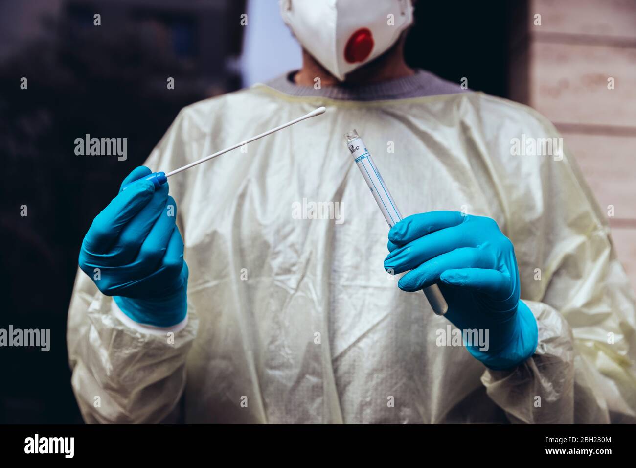 Healthcare worker holding swab test kit for PCR testing Stock Photo - Alamy