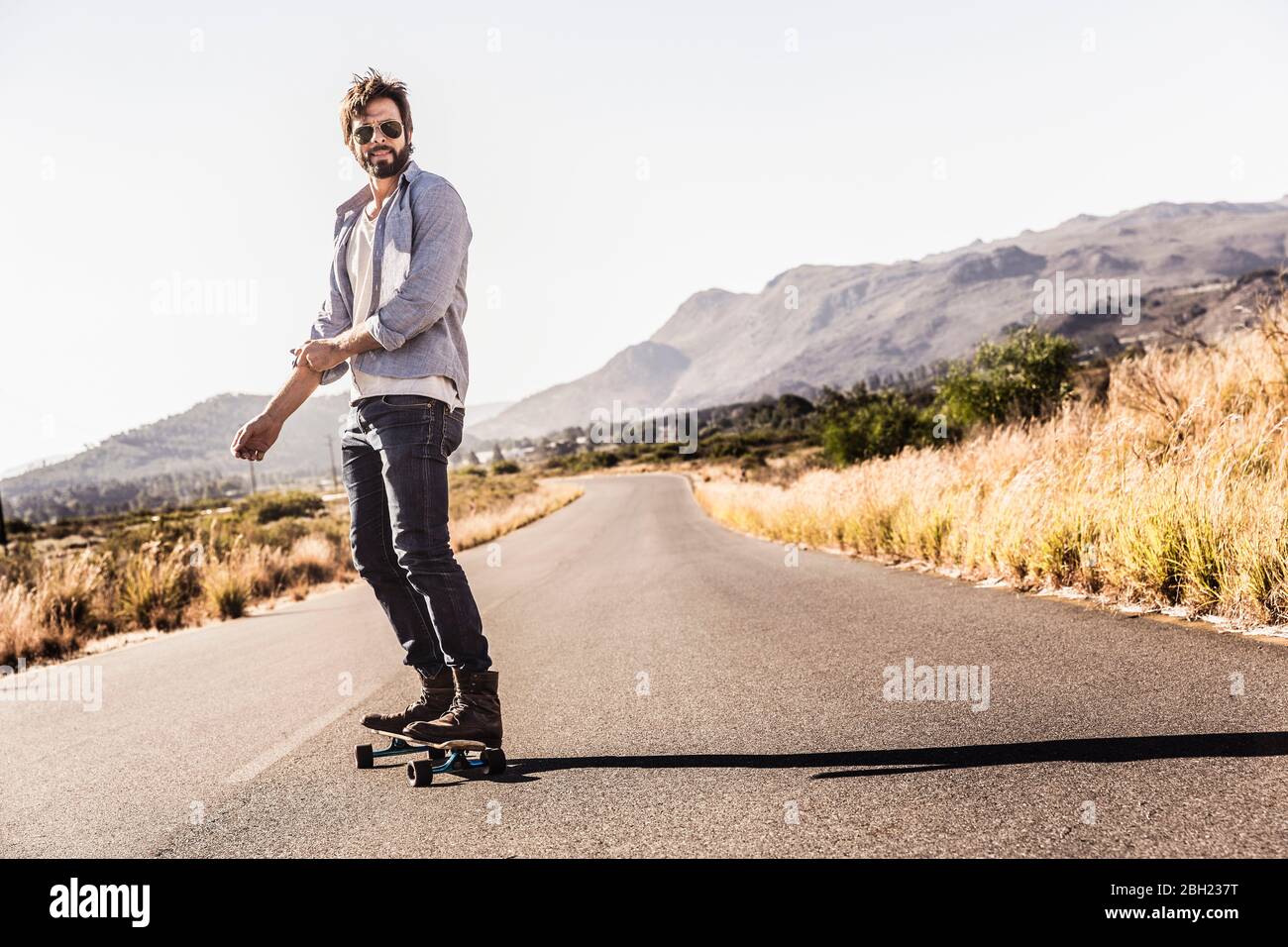 Riding skateboard man hi-res stock photography and images - Alamy
