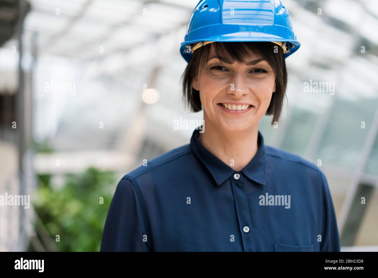 Female architect wearing blue hard hat, portrait Stock Photo - Alamy Female architect wearing blue hard hat, portrait Stock Photo - Alamy