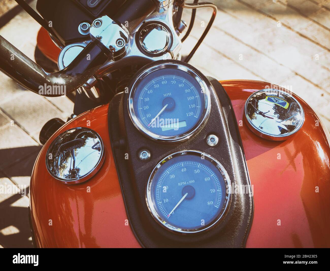 Speedometers on the red tank of the motorcycle top view Stock Photo - Alamy