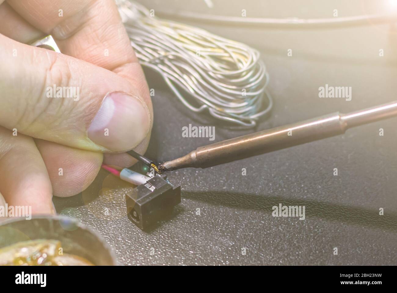 technical master soldering parts with a soldering iron. resin, the ...