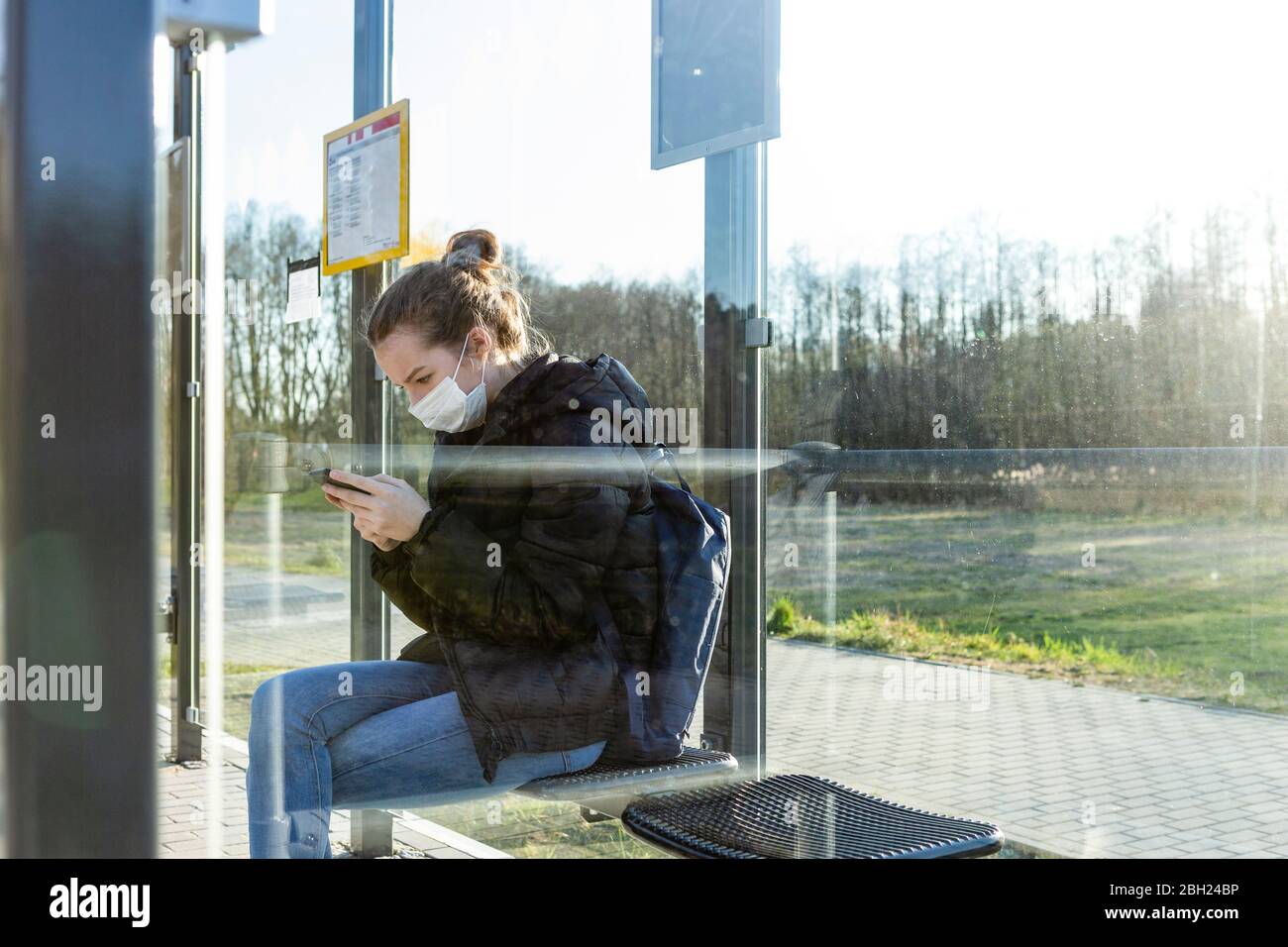 Girl alone at bus stop hi-res stock photography and images - Alamy