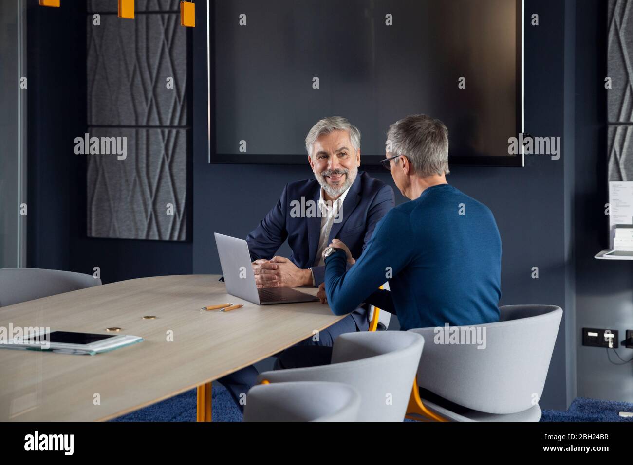 Two men working together on a project hi-res stock photography and ...