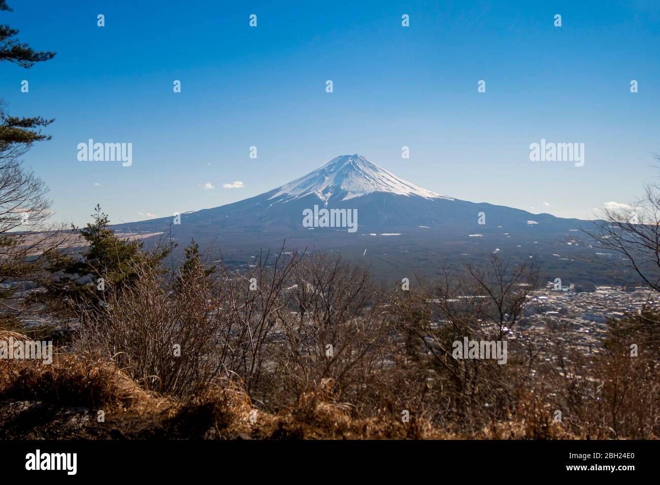 The peak of Mountain Fuji under clear blue sky in the midday Stock ...