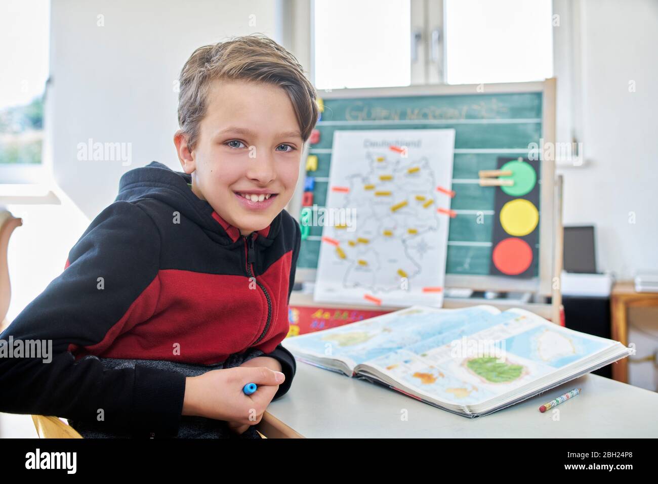 Portrait of smiling boy, learning at home Stock Photo - Alamy