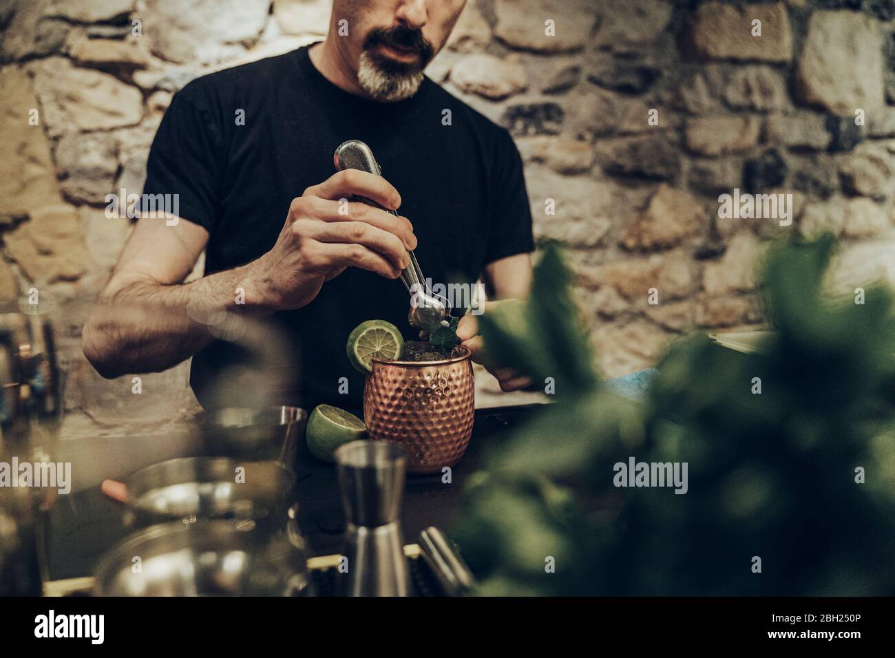 Bartender mixing cocktail ice hi-res stock photography and images - Alamy
